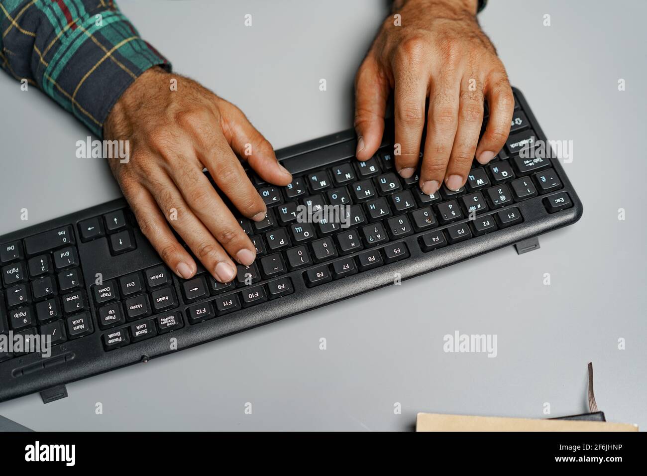 Black man hands typing on computer keyboard Stock Photo - Alamy