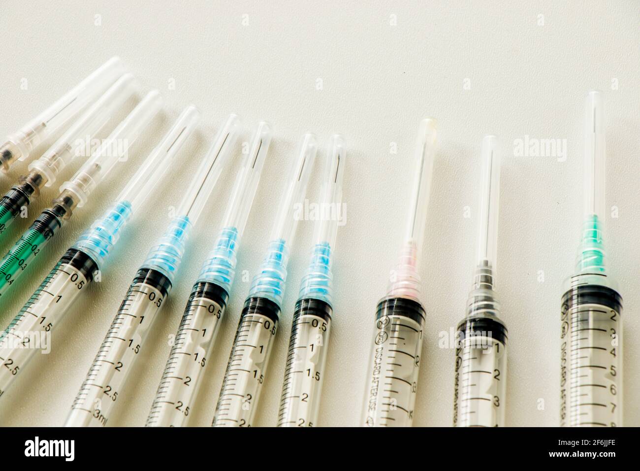 Set of medical empty needles, big and insulin needles on the white ...