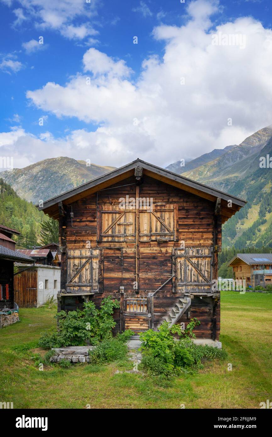 Traditional alpine barn in valley, Oberwald, Switzerland Stock Photo ...