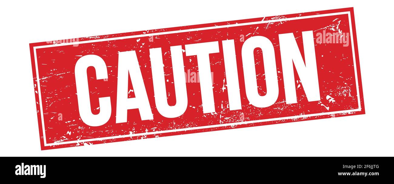 CAUTION text on red grungy rectangle stamp sign Stock Photo - Alamy