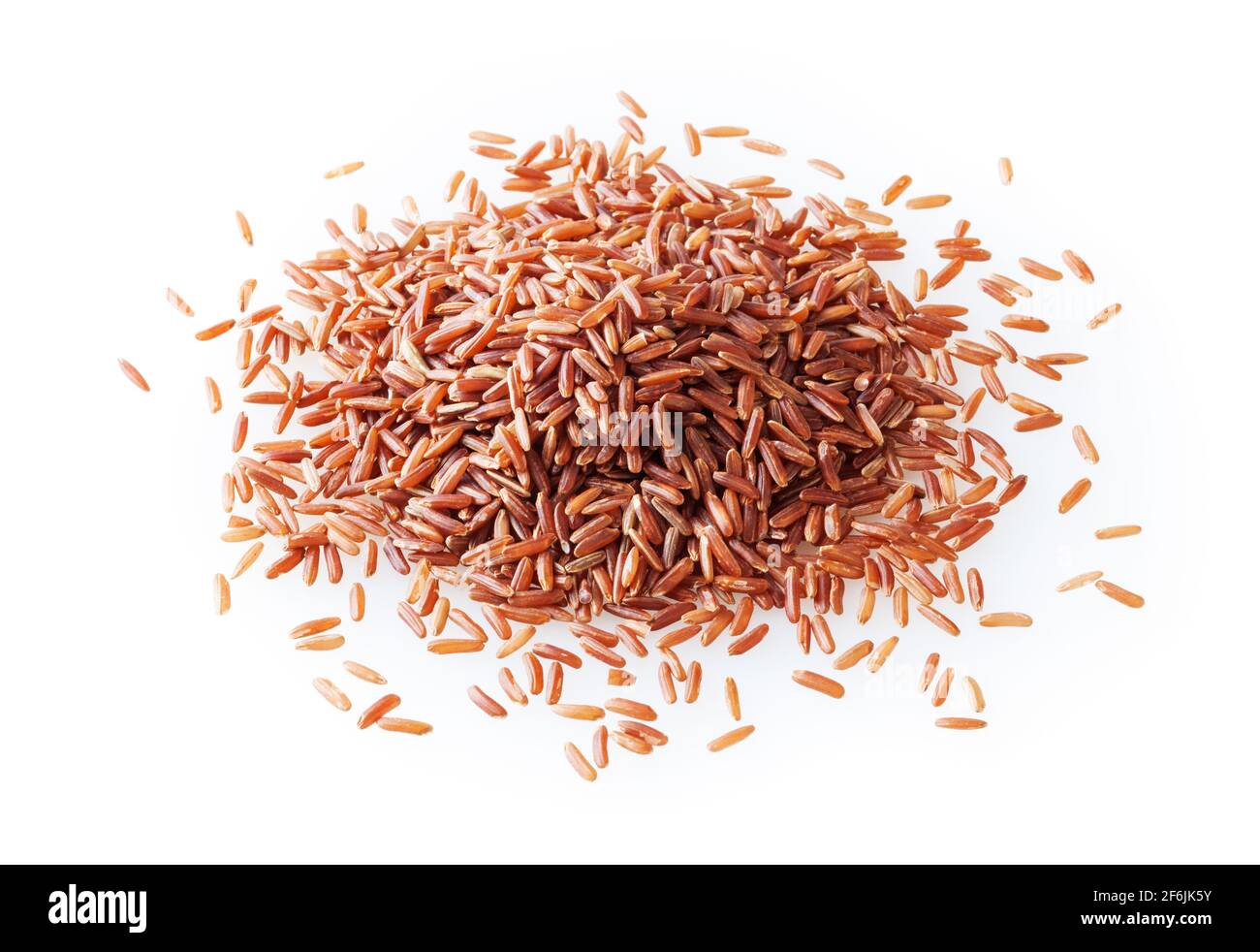 Heap of uncooked red rice isolated on white background Stock Photo - Alamy