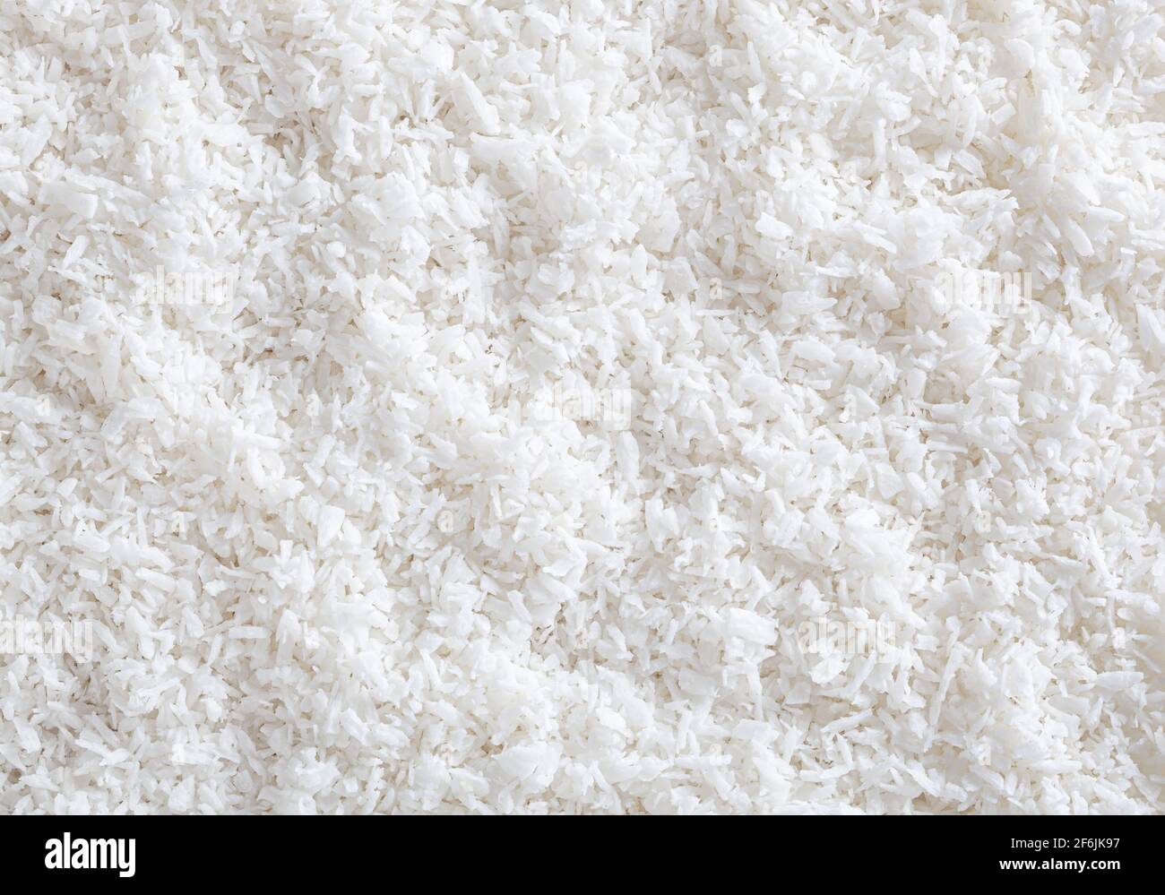 Fresh coconut flakes background Stock Photo - Alamy
