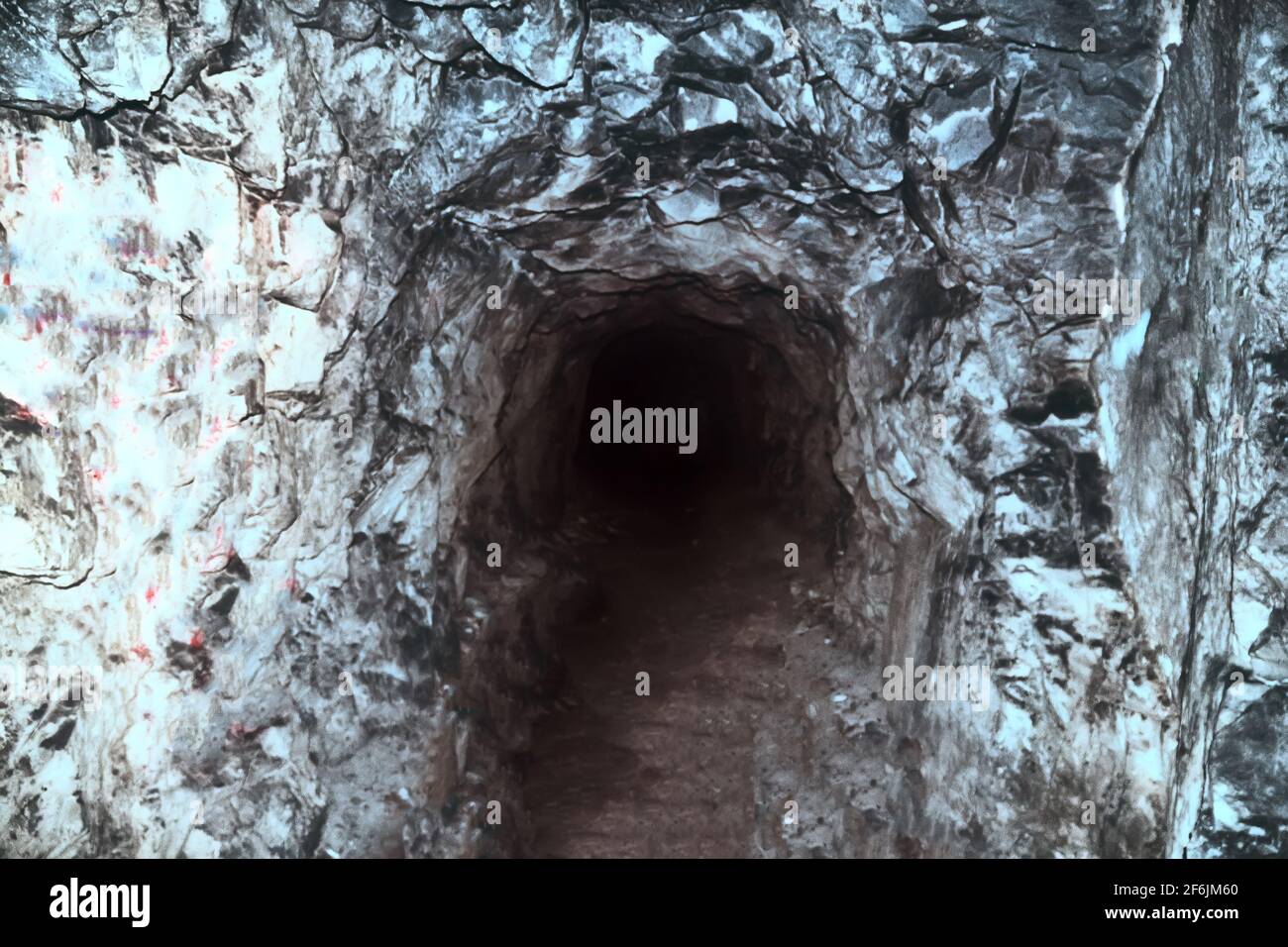 An old flooded mine, an underground corridor, and walls covered with ...