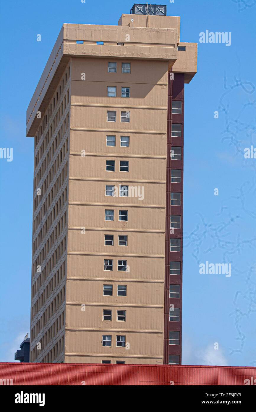 Upward view of tall residential building against blue sky Stock Photo ...