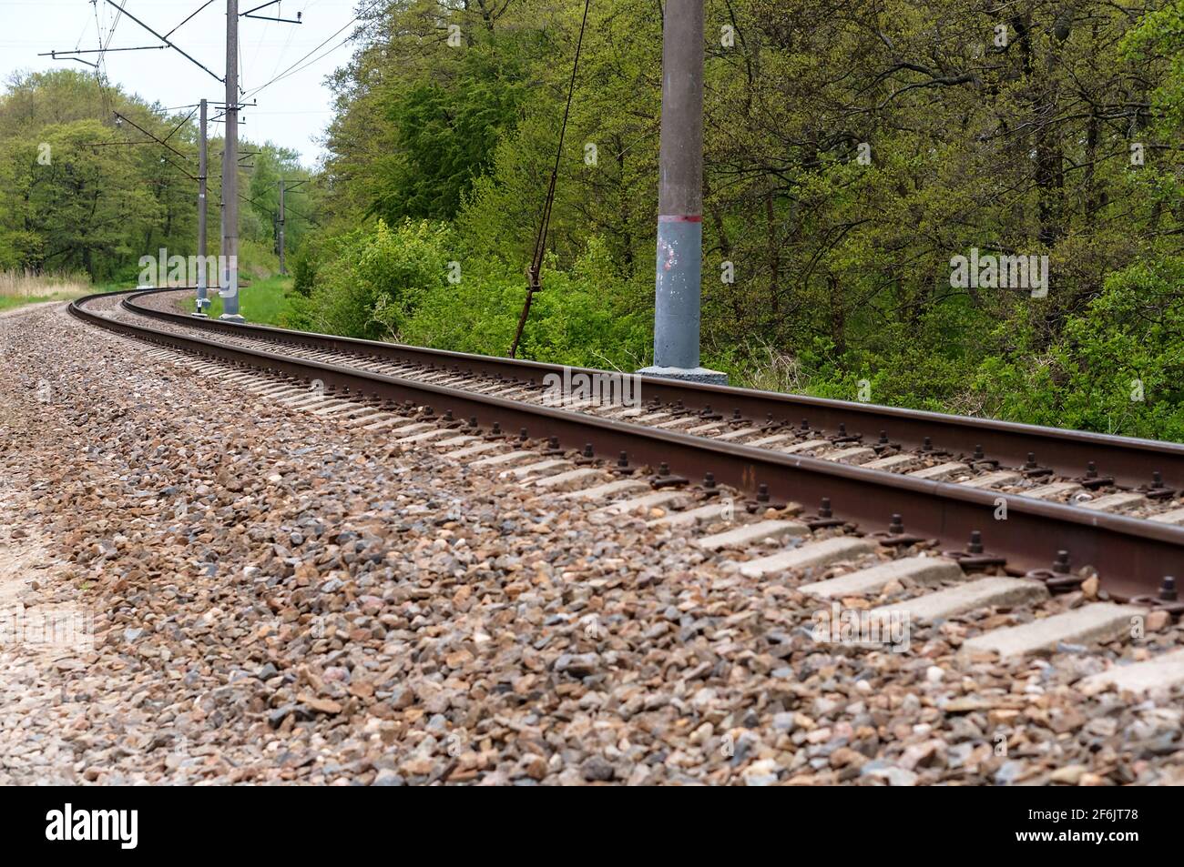 A bend in the railway tracks. No train on the railway track. Railroad ...