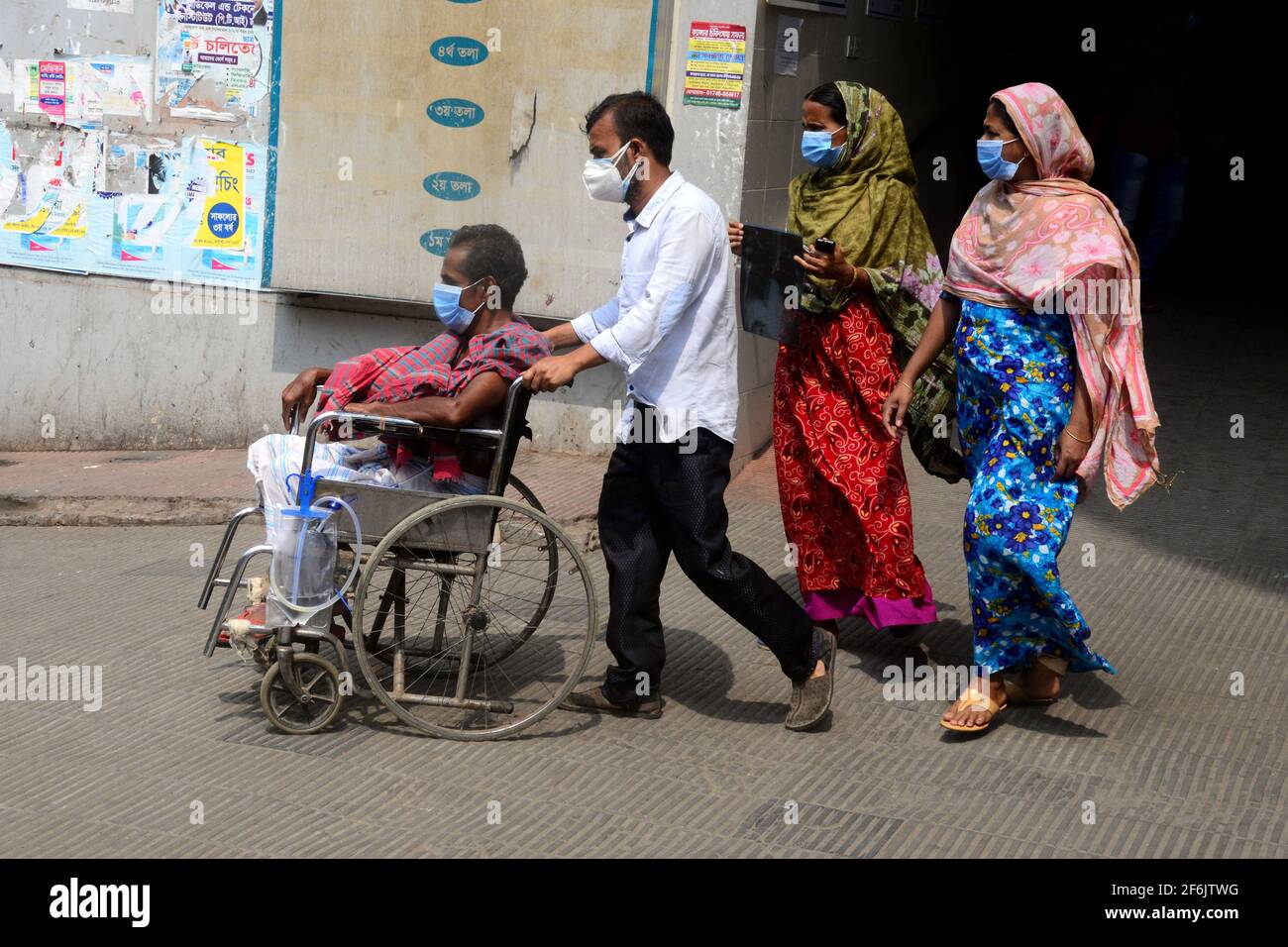Relative transport a patient at Dhaka Medical College Hospital for ...