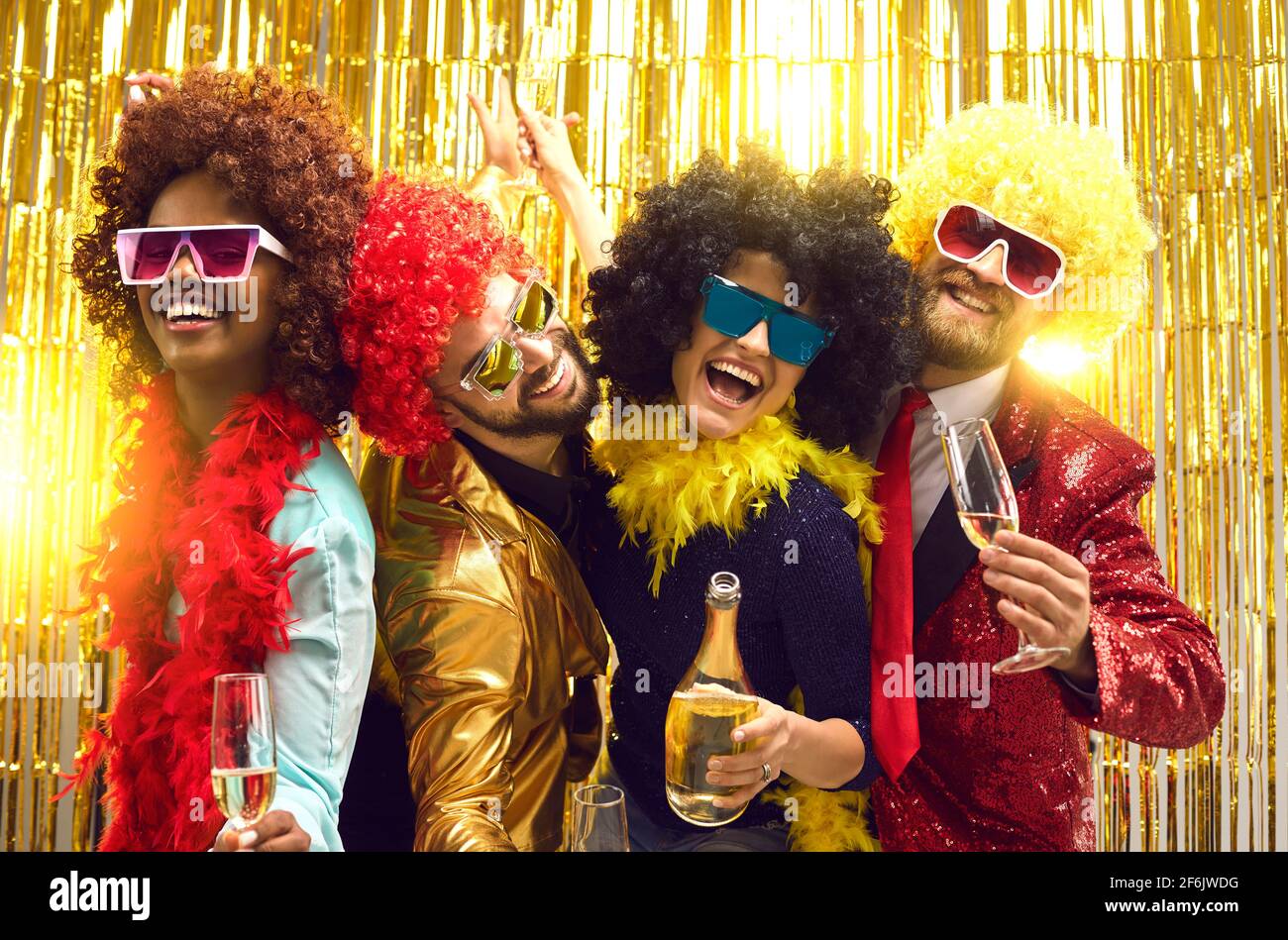 Happy millennials friends celebrating drinking champagne and making ...