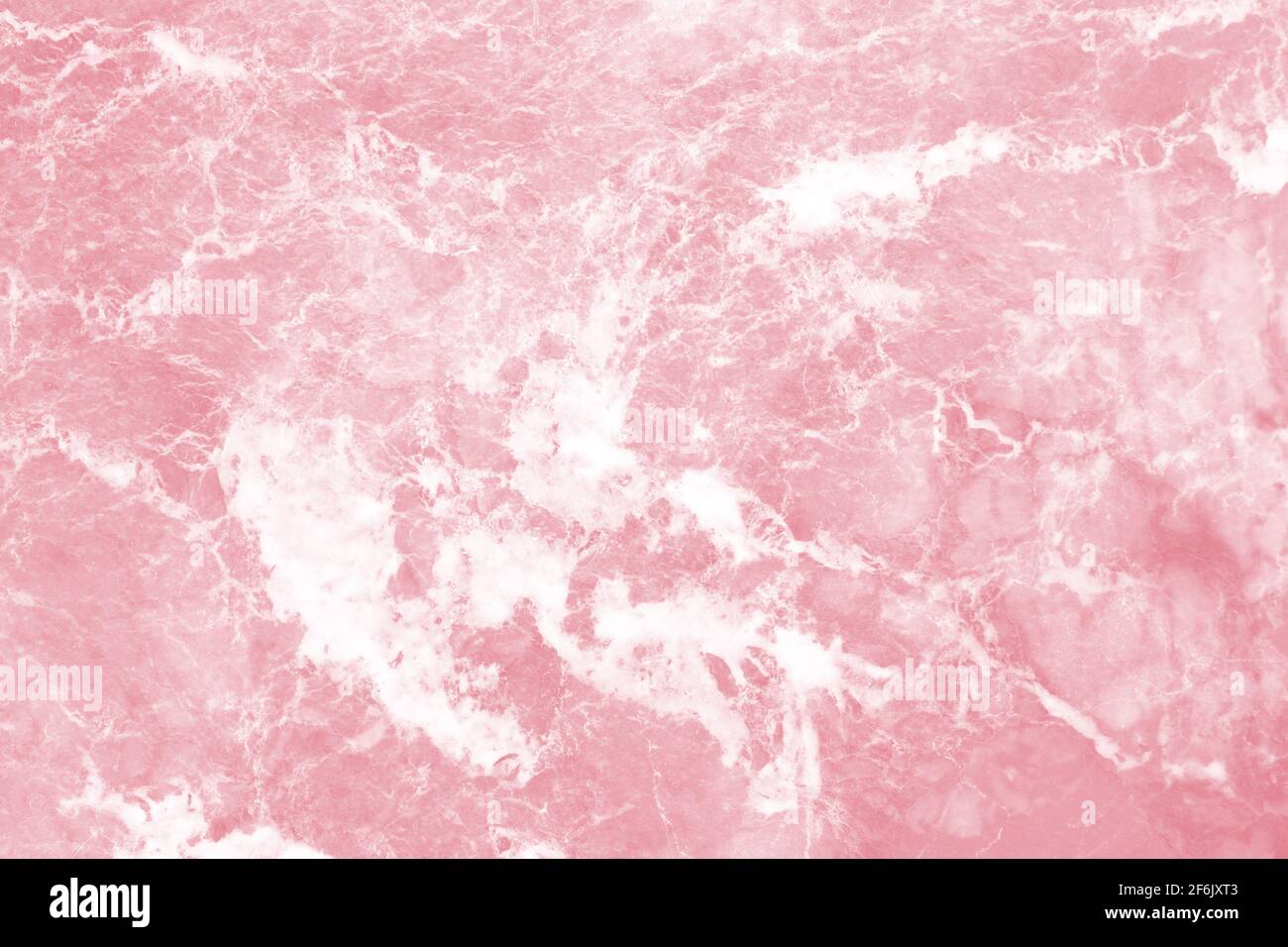 Close-up photo texture of pink marble pattern with white veins. Stone ...