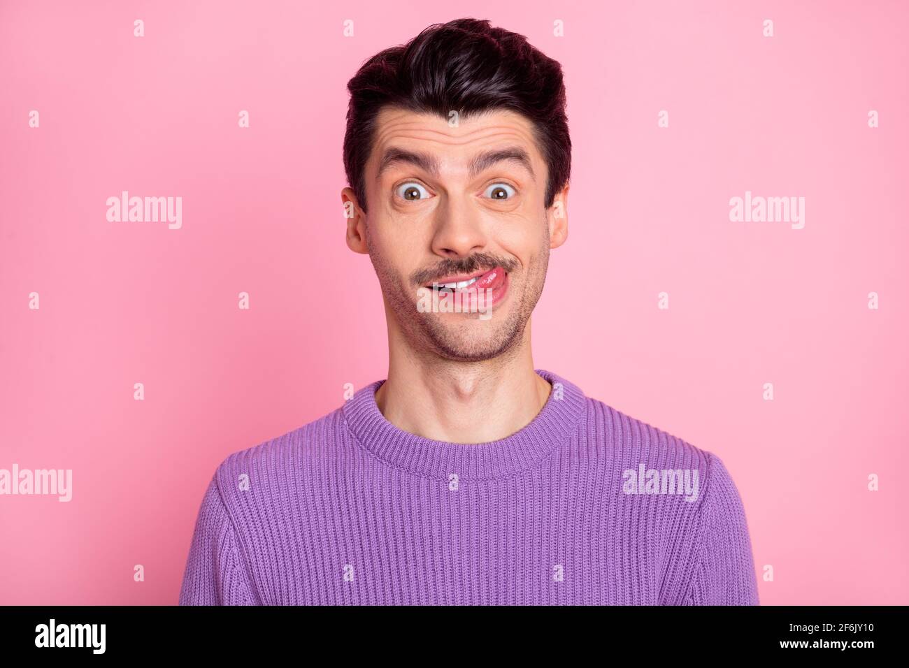 Portrait Of Attractive Cheerful Hilarious Guy Licking Lip Having Fun Isolated Over Pink Pastel