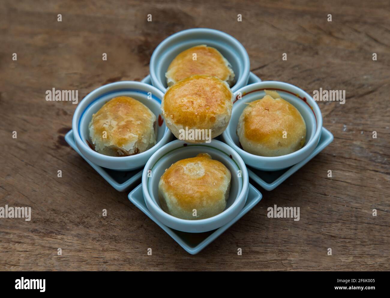 A traditional asian pastry or Tao Sor on rustic wooden table. Chinese ...