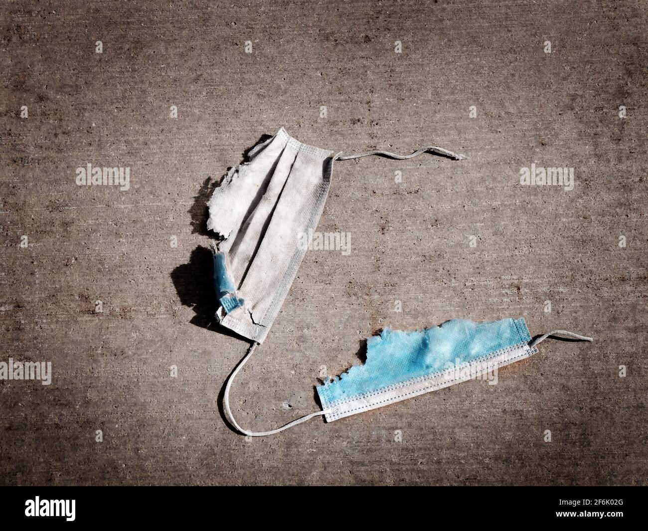 Abandoned worn torn face mask for covid coronavirus pandemic Stock ...