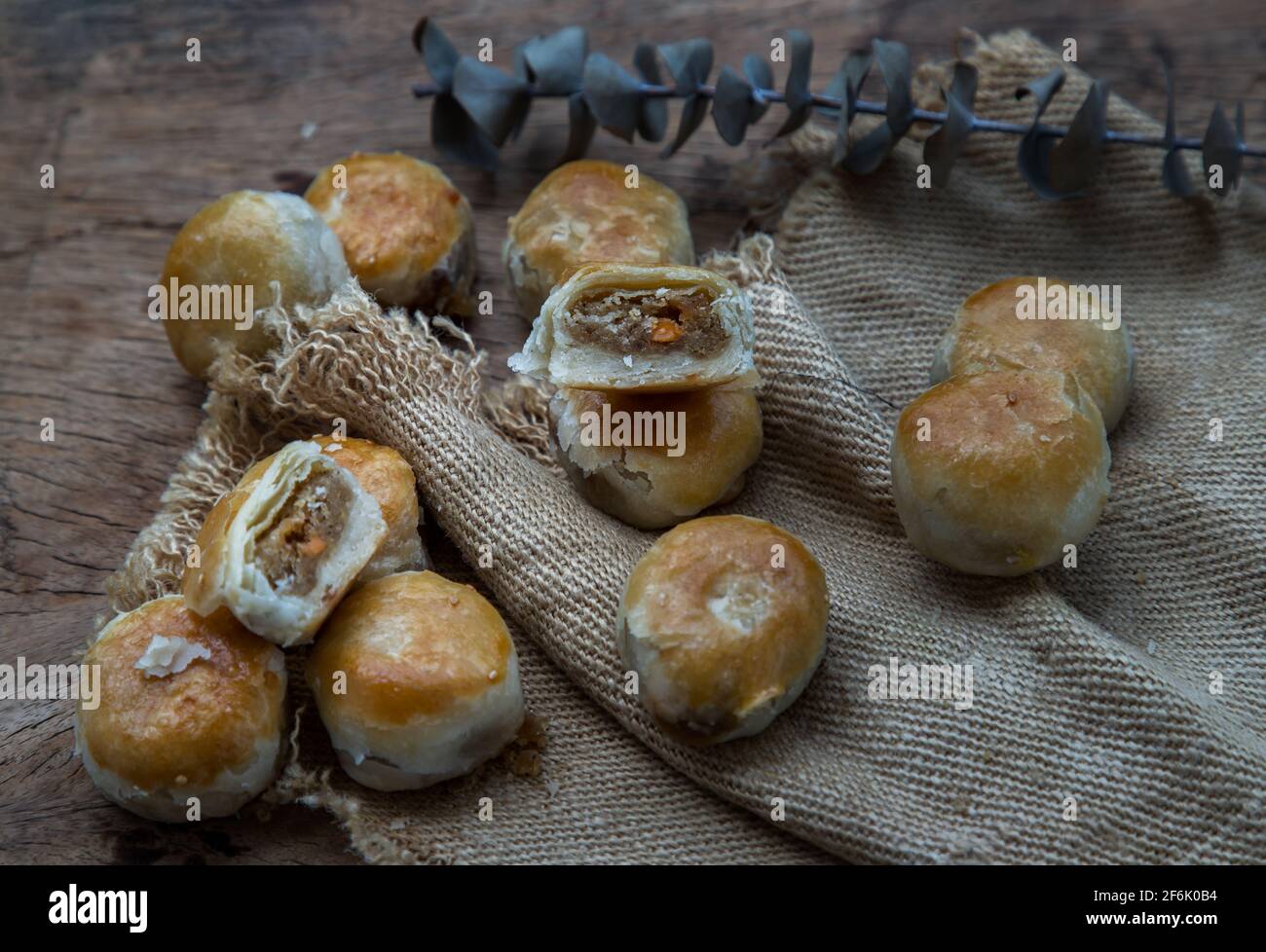 A traditional asian pastry or Tao Sor on rustic wooden table. Chinese ...