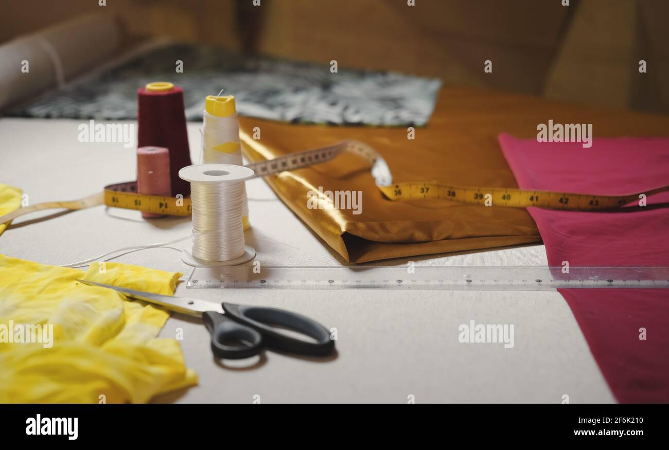 Dressmaker workplace table with sewing set. Professional objects. Craft ...