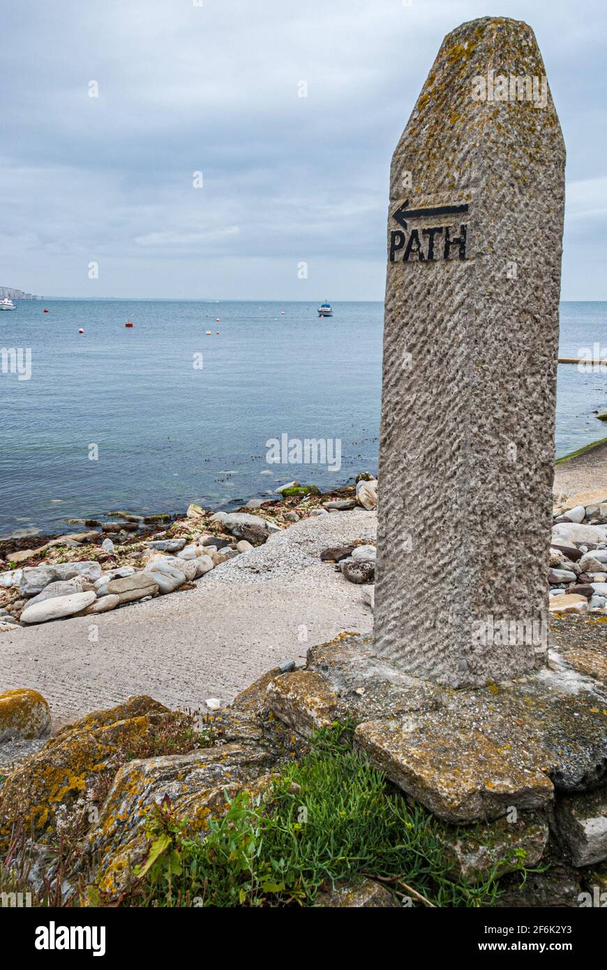 A stone marker for a coastal path along the shoreline on the South ...