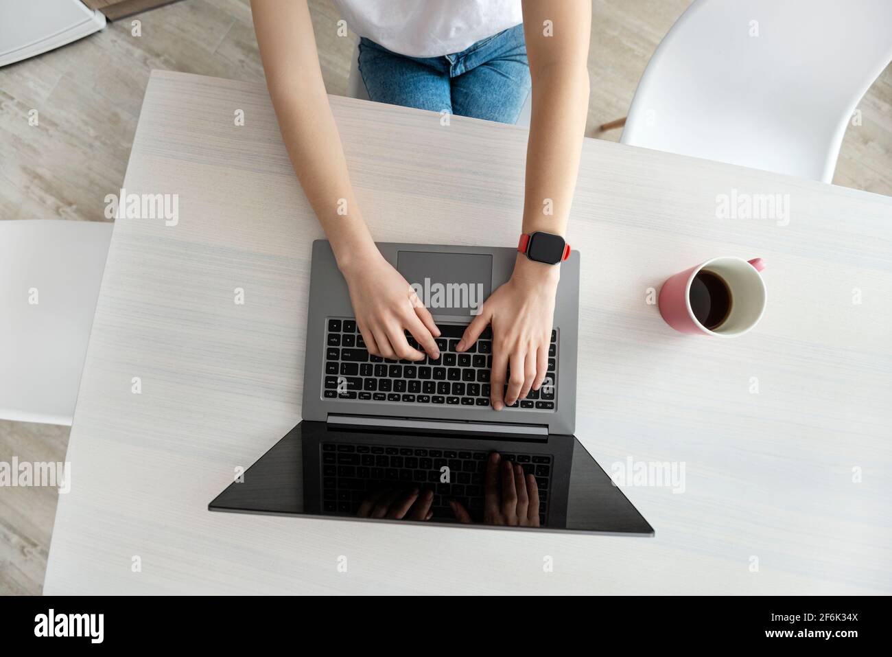 Woman working on the laptop in modern space. Top view. Home office ...