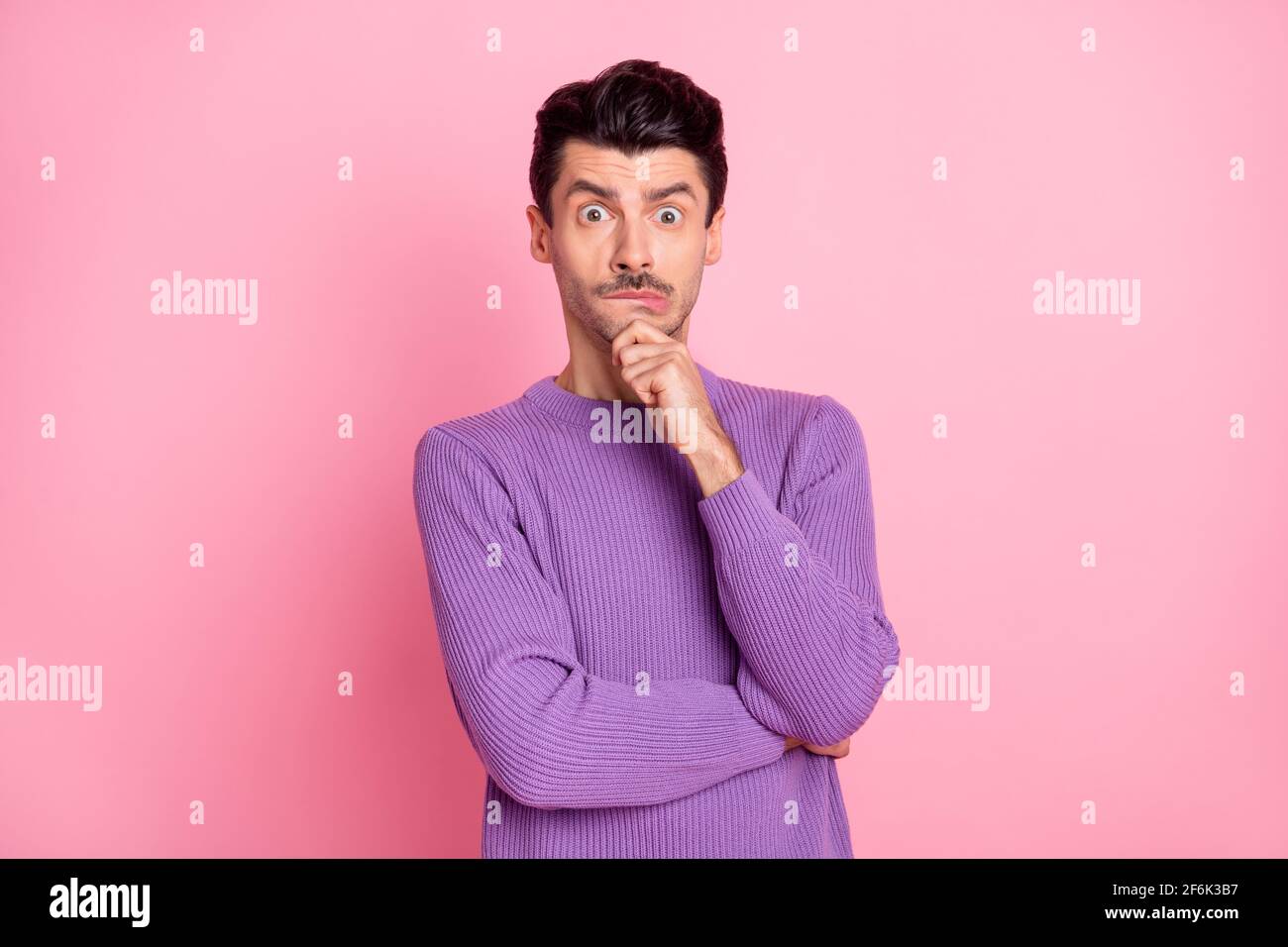 Photo Of Handsome Unsure Young Guy Wear Violet Sweater Arm Chin