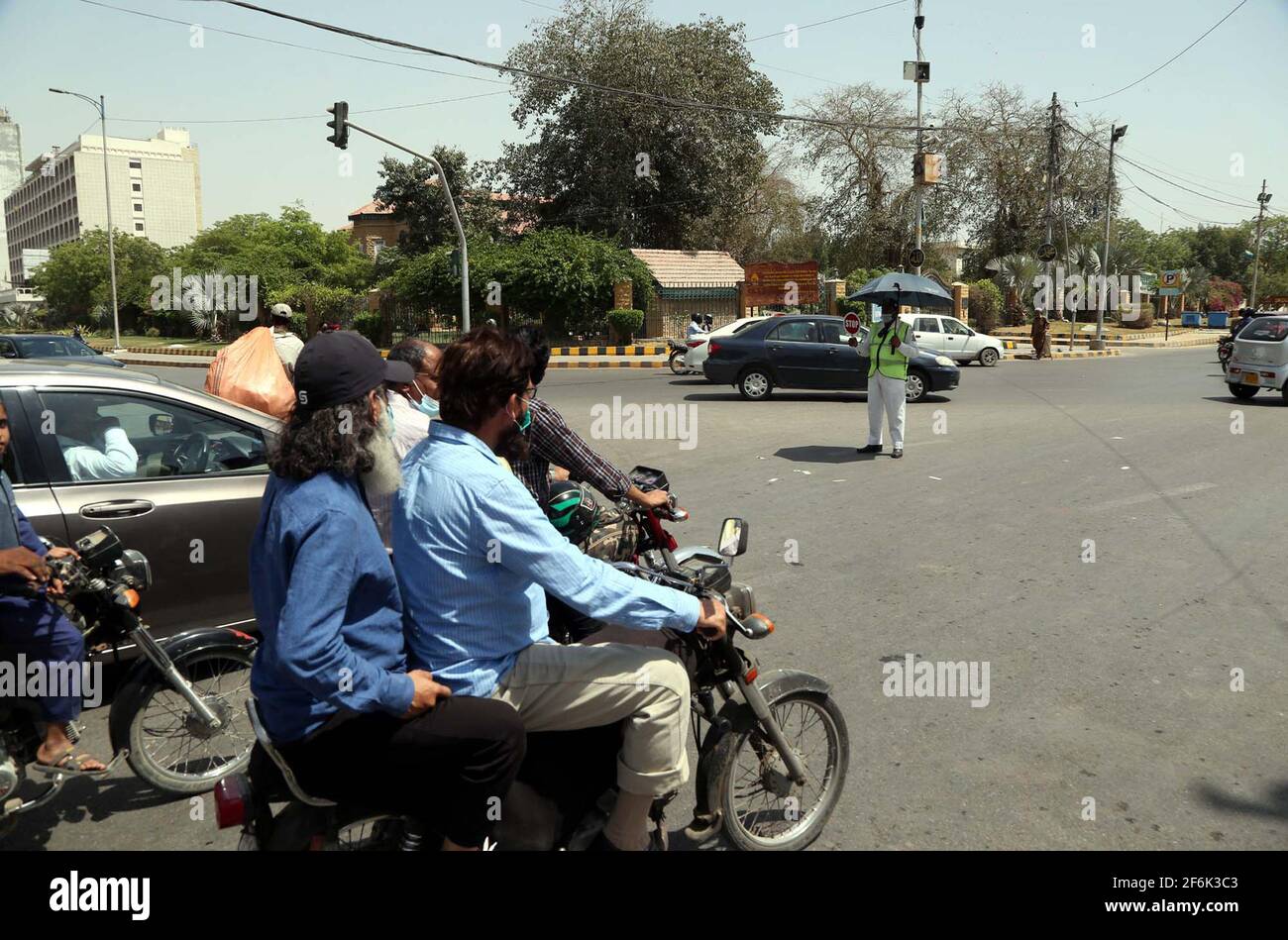 Traffic Police official using umbrella to protect himself from ...