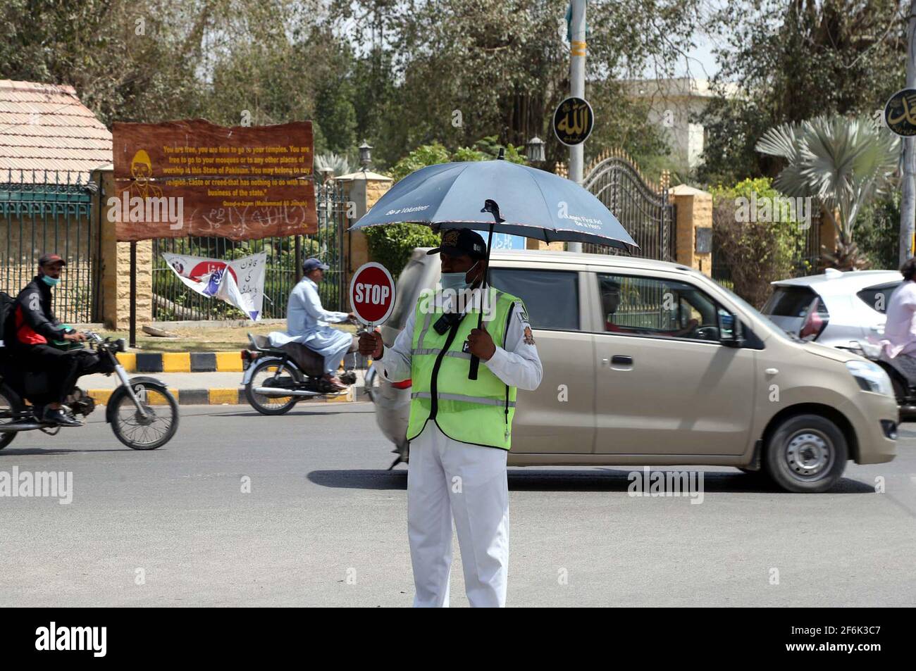 Traffic Police official using umbrella to protect himself from ...