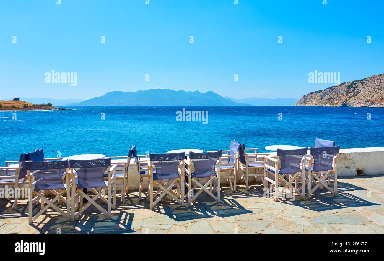 Aegina Island in Greece. Open air cafe by the sea in Perdika village ...