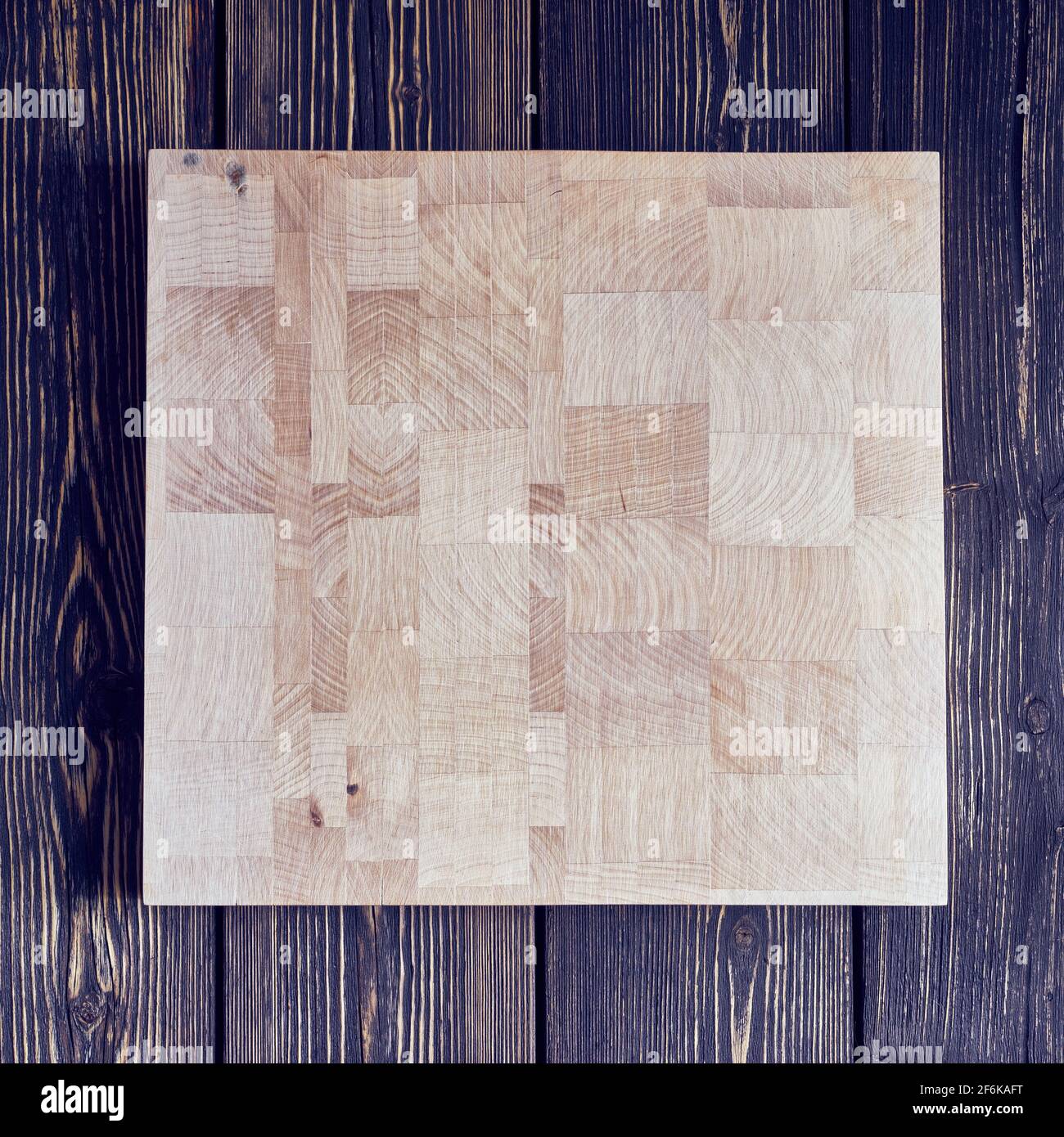 Chopping board on textured background Stock Photo - Alamy