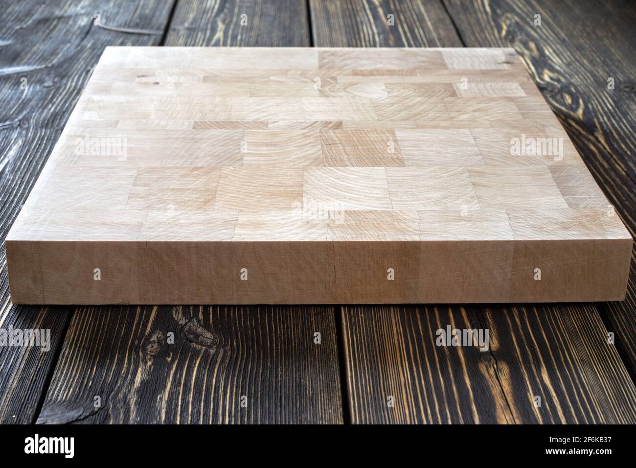 Chopping board on textured background Stock Photo - Alamy