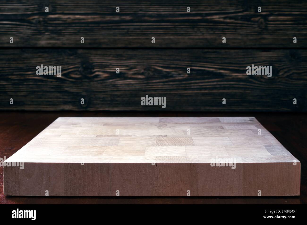 Chopping board on textured background Stock Photo - Alamy