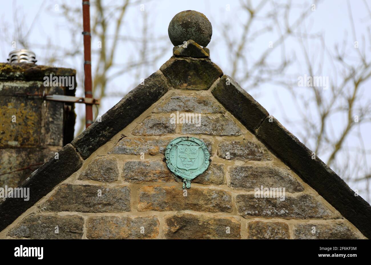 Antique fire insurance mark on an old property at Ashover in Derbyshire ...