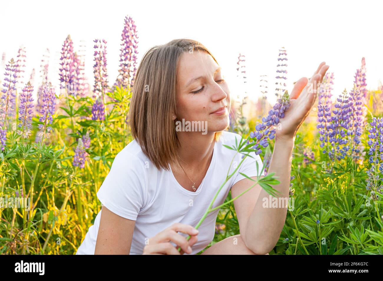 Happy girl smiling outdoor. Beautiful young brunete woman resting on ...
