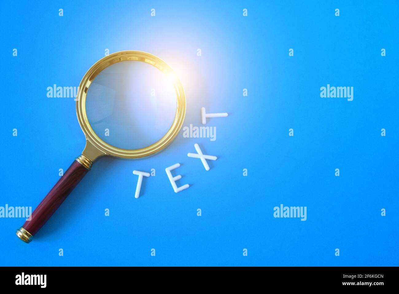 Magnifier on blue background with inscription text with sunlight Stock ...