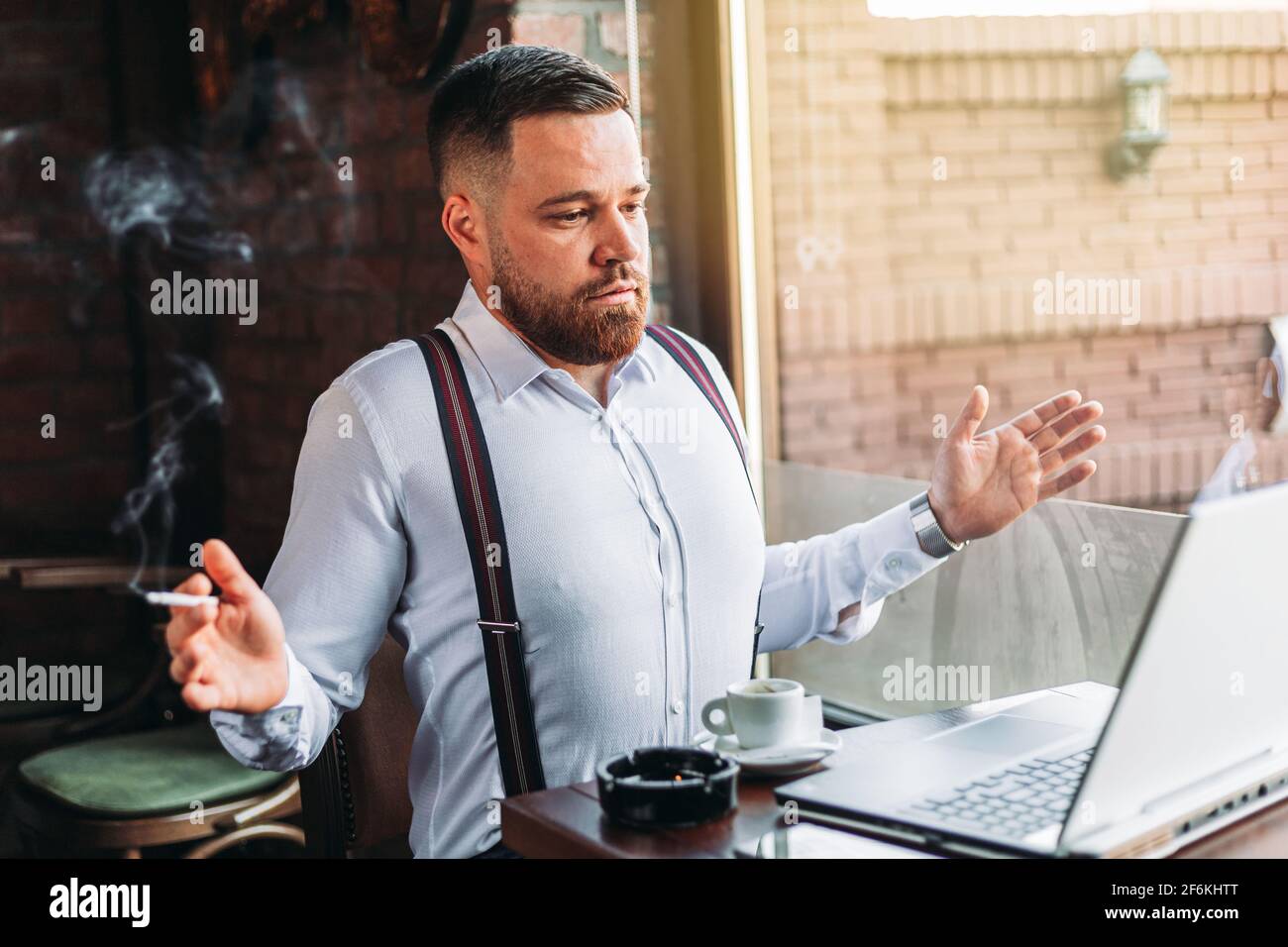 Man smoking cigarette drinking coffee hi-res stock photography and ...