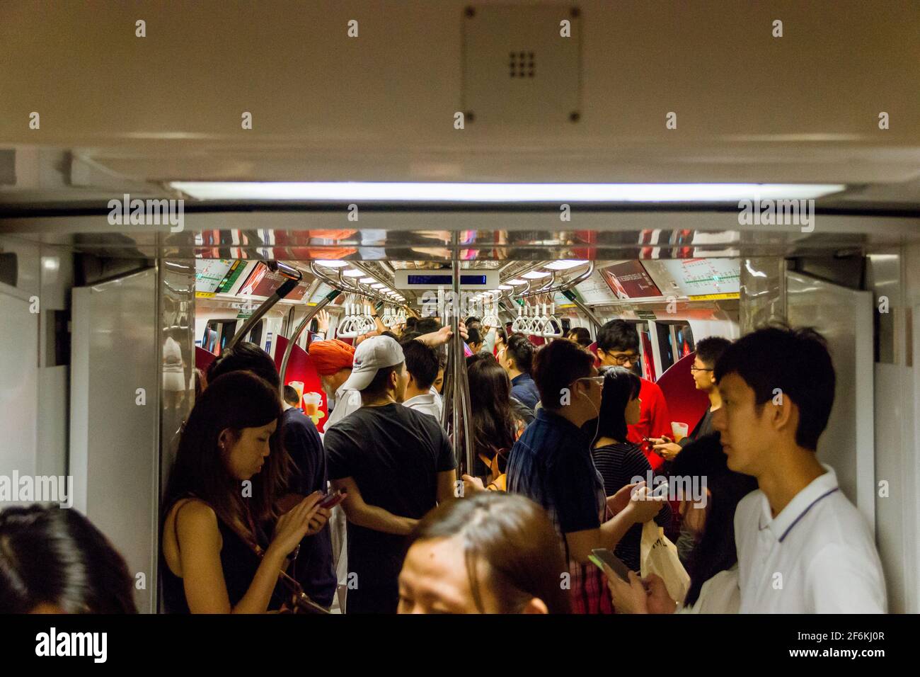 Singapore, Singapore - December 25, 2013: One crowded MRT ( a rapid ...