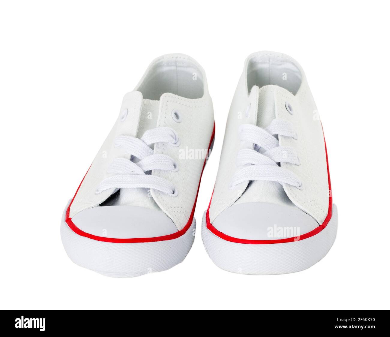 White canvas shoes with red strip. Isolated on a white background Stock ...