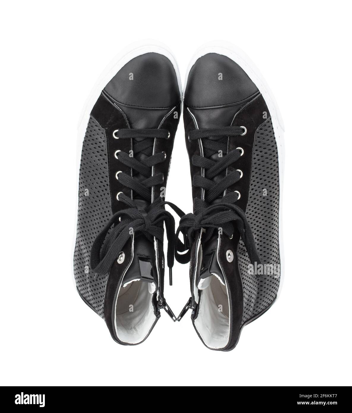 Pair of black perforated leather sneakers. Isolated on a white ...