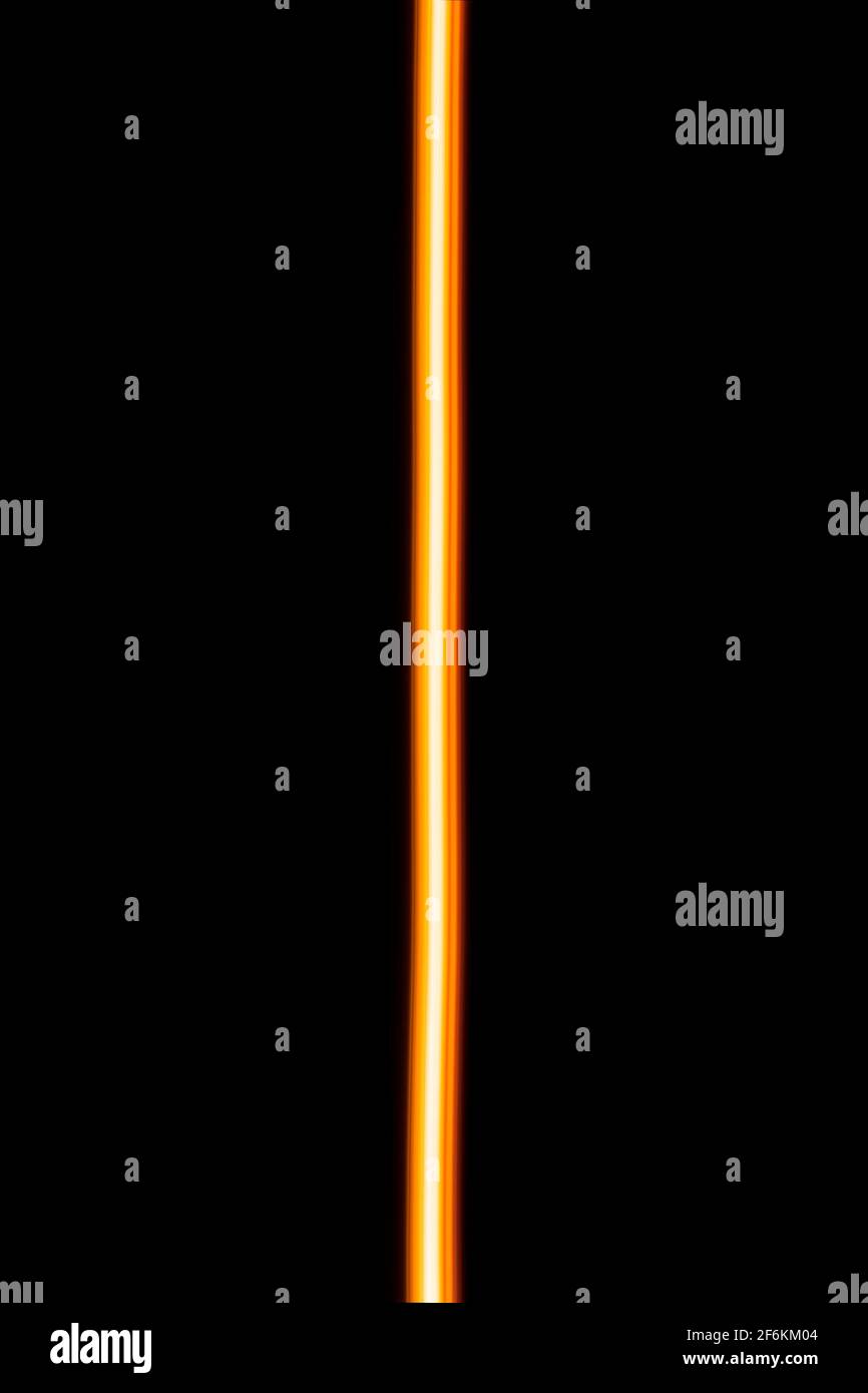 straight yellow light lines on a black background Stock Photo - Alamy