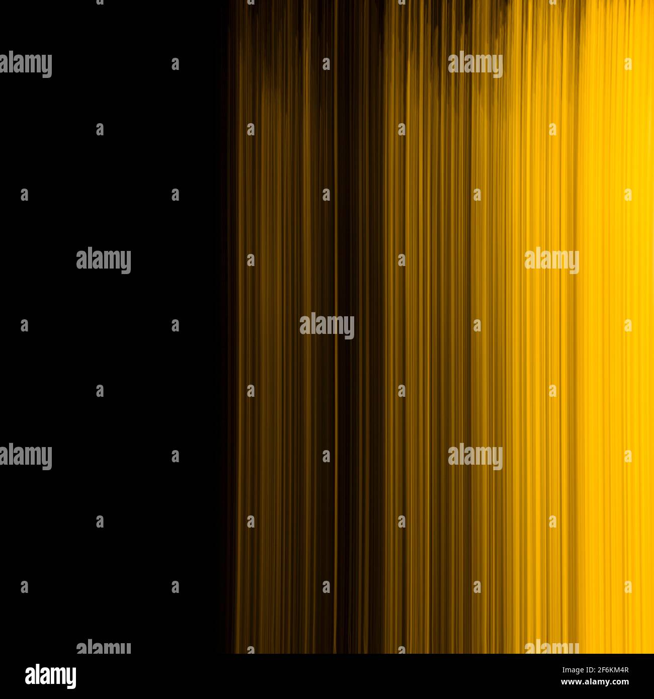 straight yellow light lines on a black background Stock Photo - Alamy