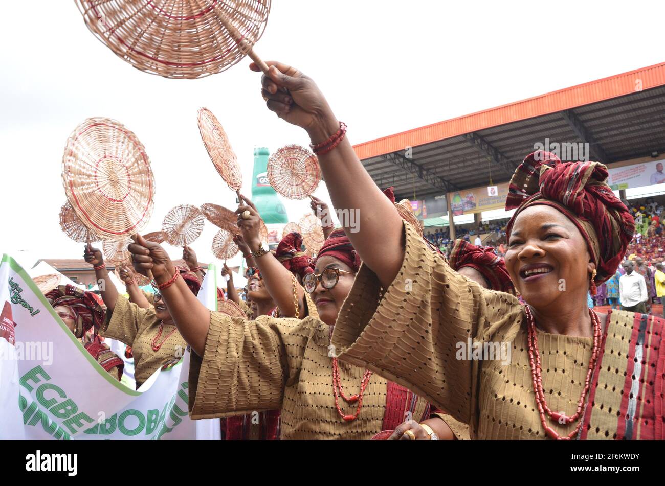 Nigerian women showcasing their traditional attire in paying homage to ...