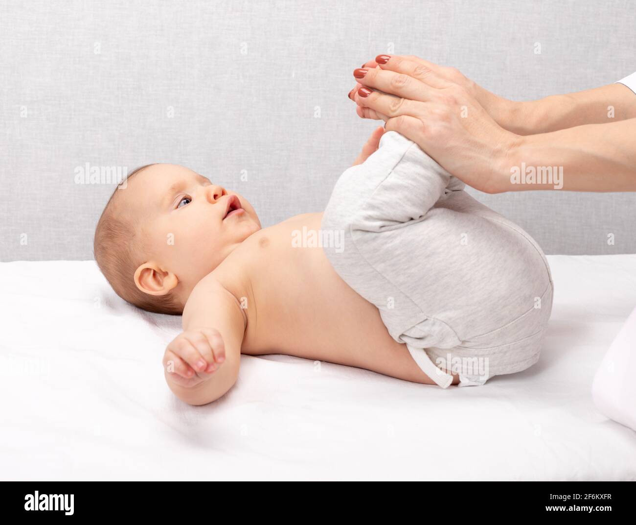 Six month baby girl receiving osteopathic or chiropractic treatment in ...