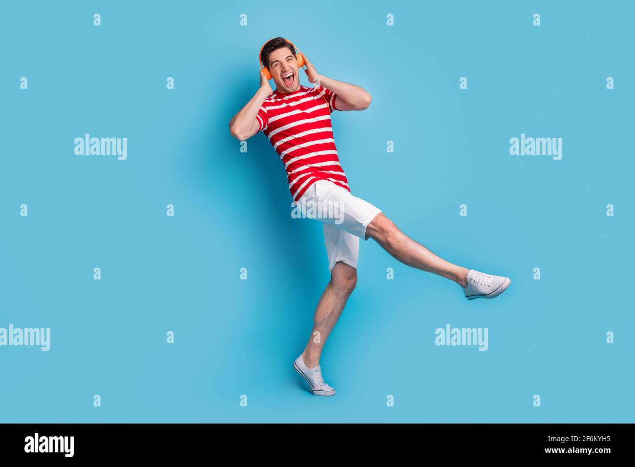 Full size photo of funky crazy guy wear headset dance funny scream song ...