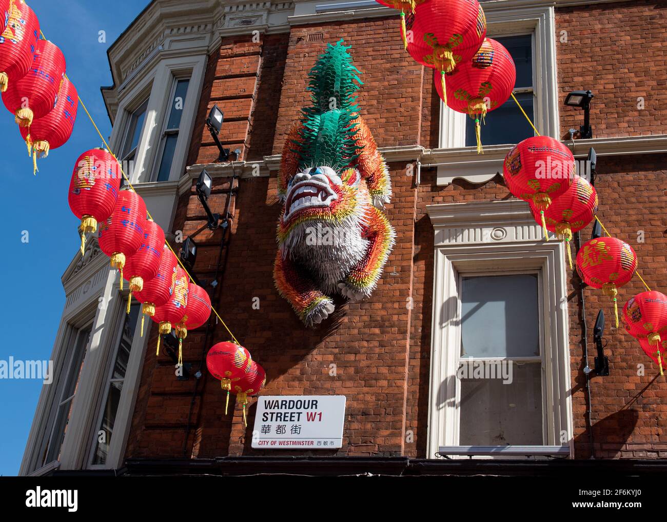 Colourful Chinese dragon on wall of red bricked building in Wardour ...