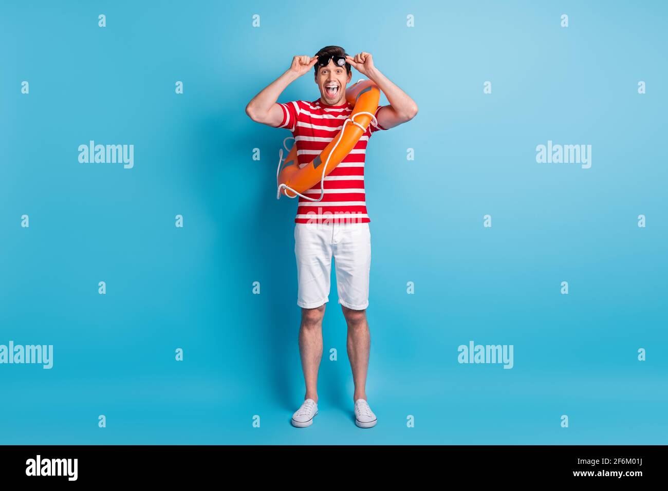 Full length body photo man wearing orange circle sunglass relaxing near ...