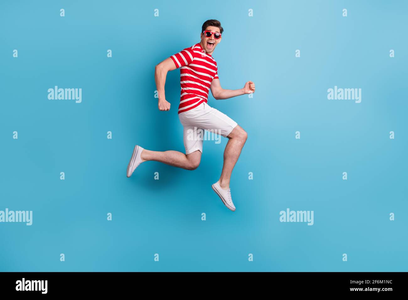 Full length body side profile photo happy man jumping high running fast ...