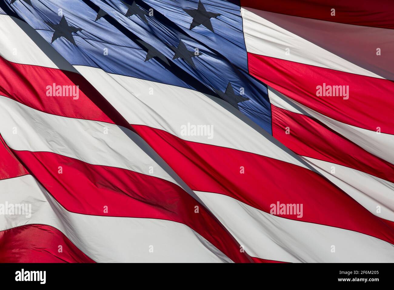 A large American flag billows in heavy spring winds in Thorpe ...