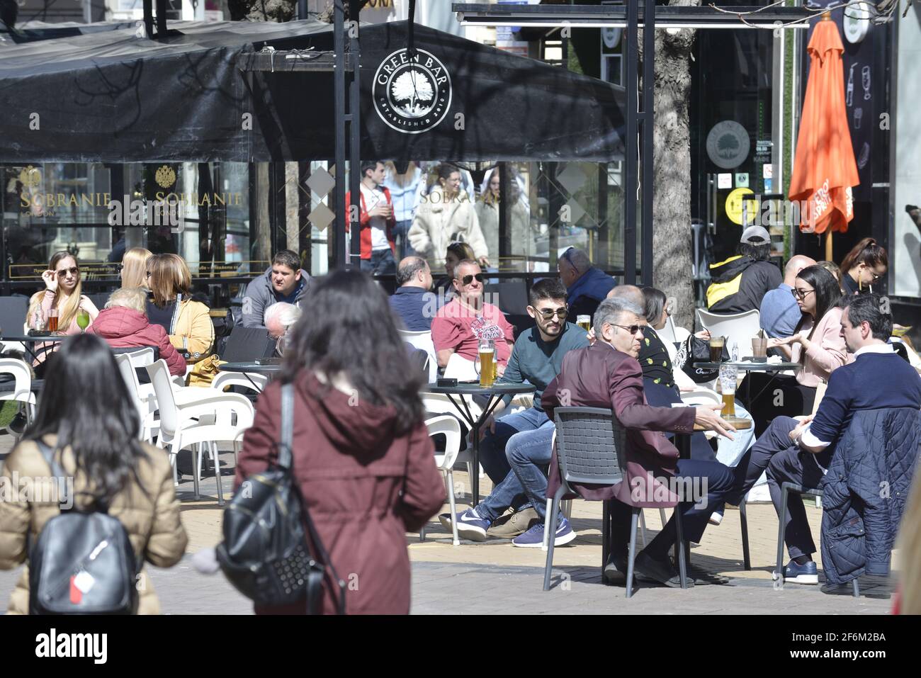 Sofia, Bulgaria - Apr 1 2021: People drinking enjoying the opened cafes ...