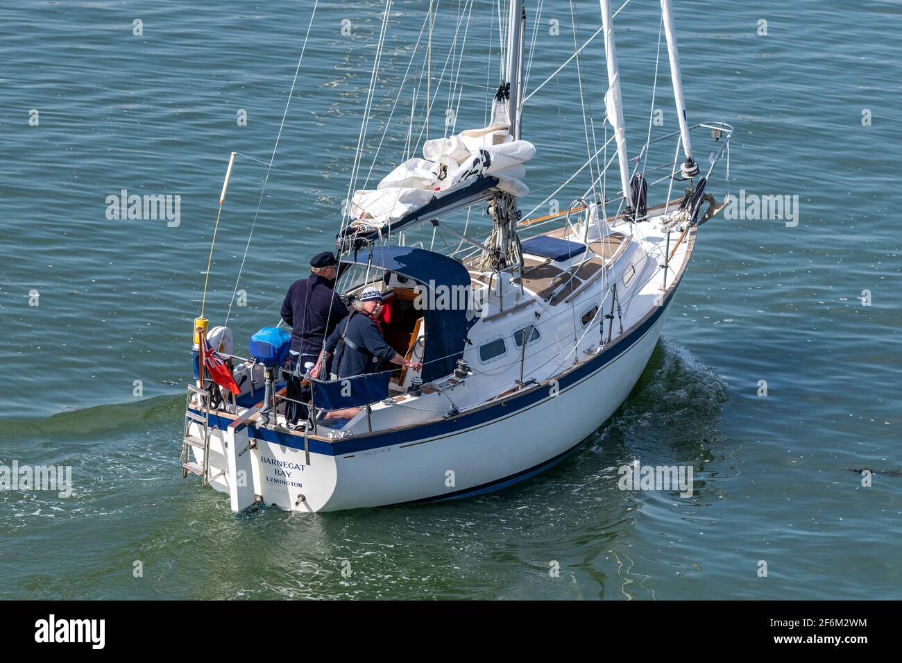 an older or elderly retire couple on a large sailing yacht or boat ...