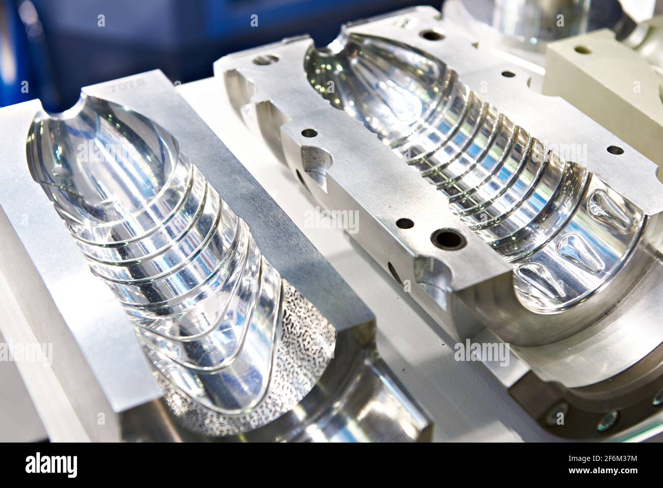 Metal molds for making plastic bottles Stock Photo - Alamy