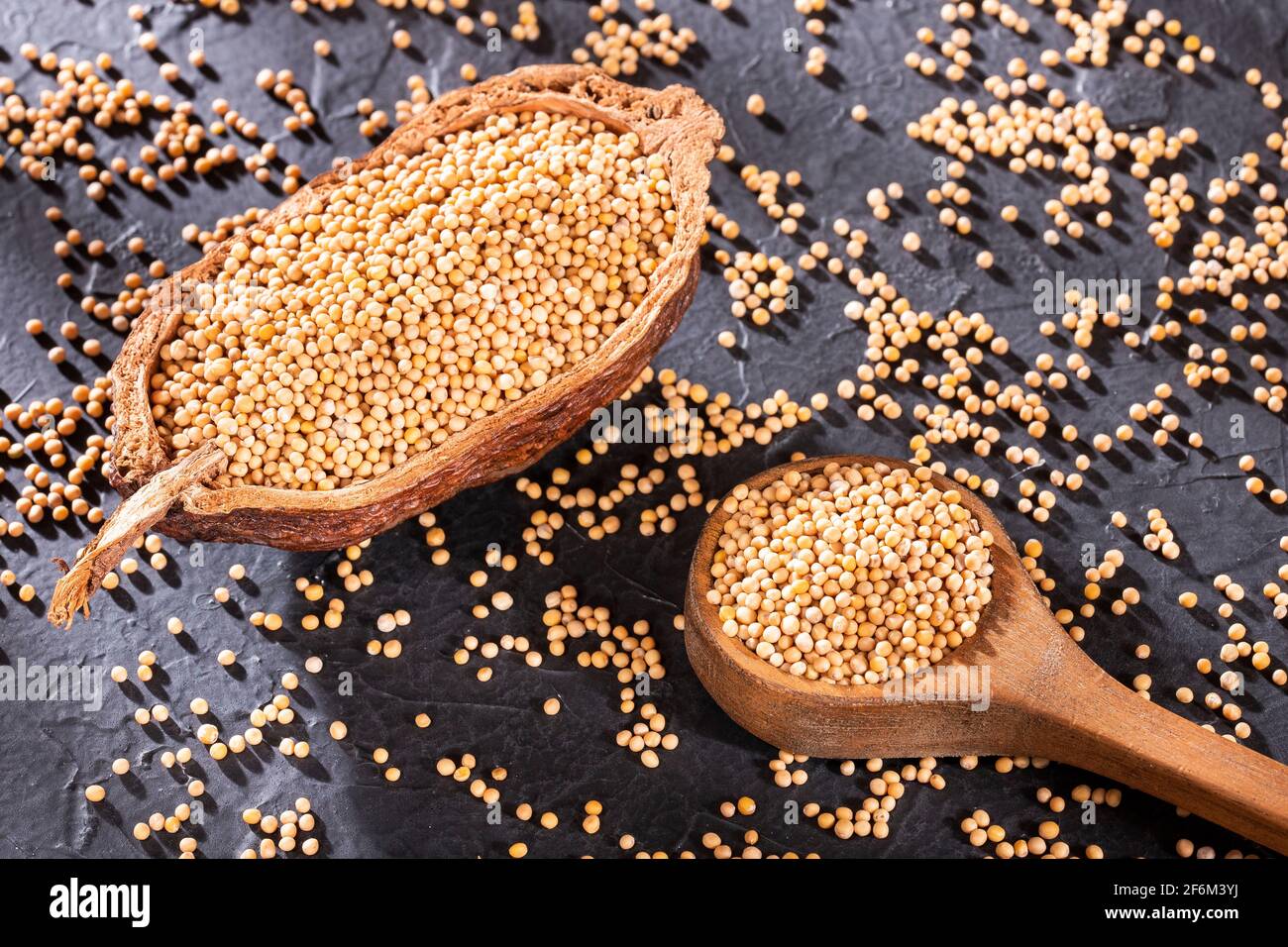Sinapis alba - Yellow mustard seeds Stock Photo - Alamy