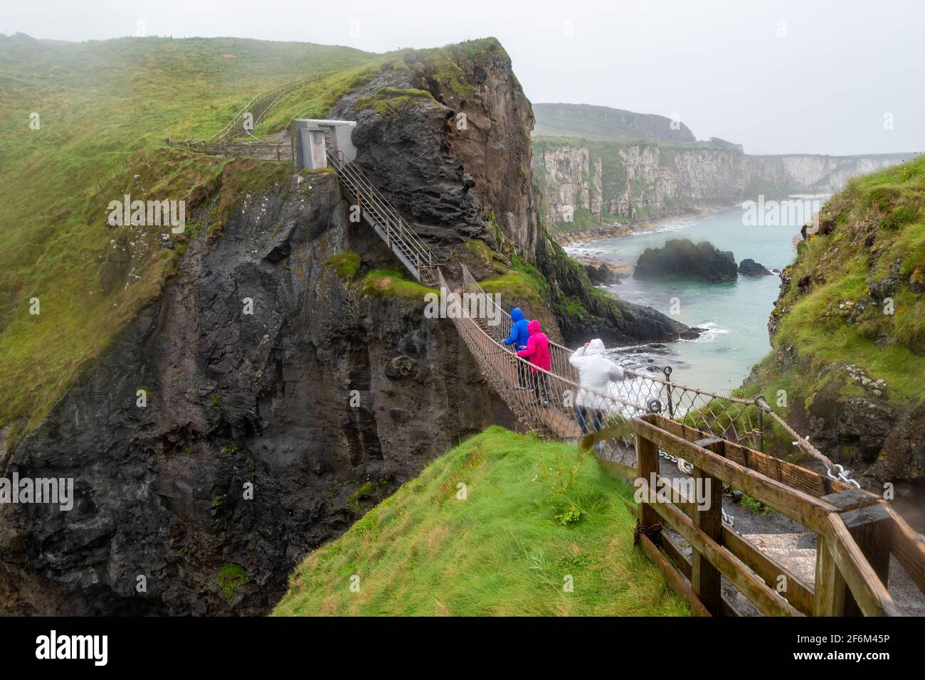 A suspension bridge between the cliffs in Northern Ireland Stock Photo ...