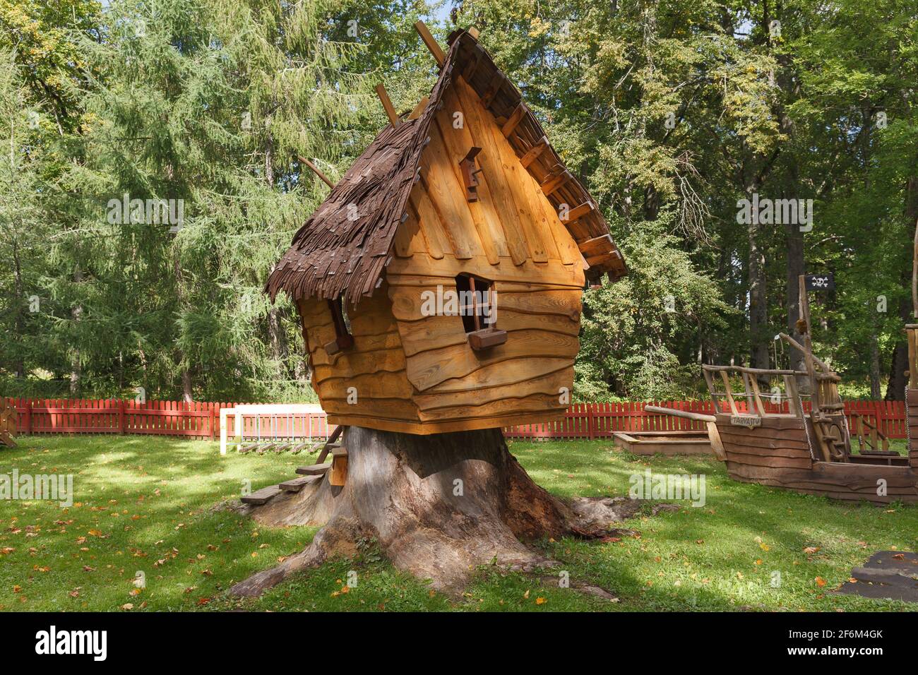 Children playground wooden hut, sunny summer day Stock Photo - Alamy