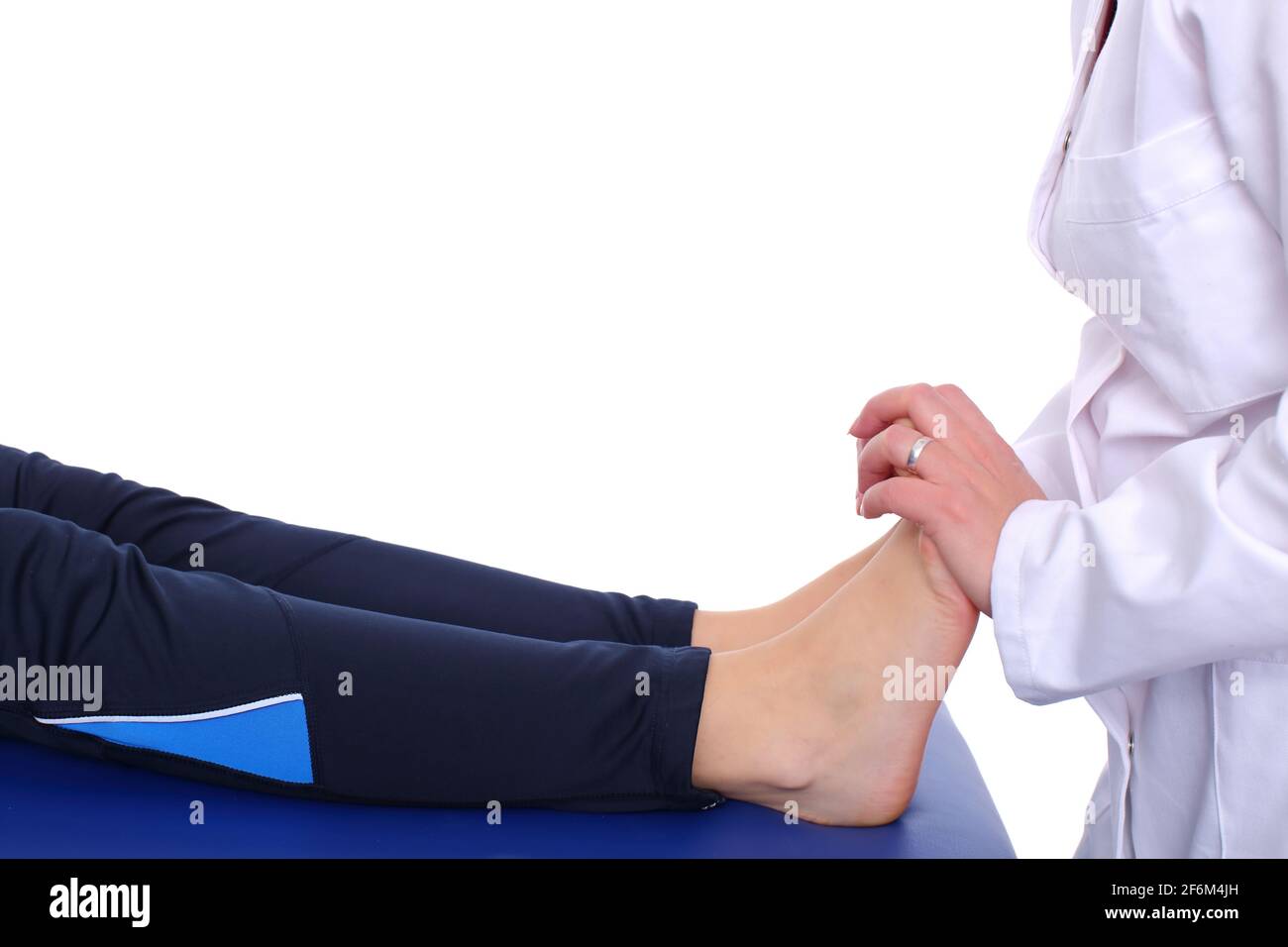 A physiotherapist performs a relaxing massage on the muscles of the ...