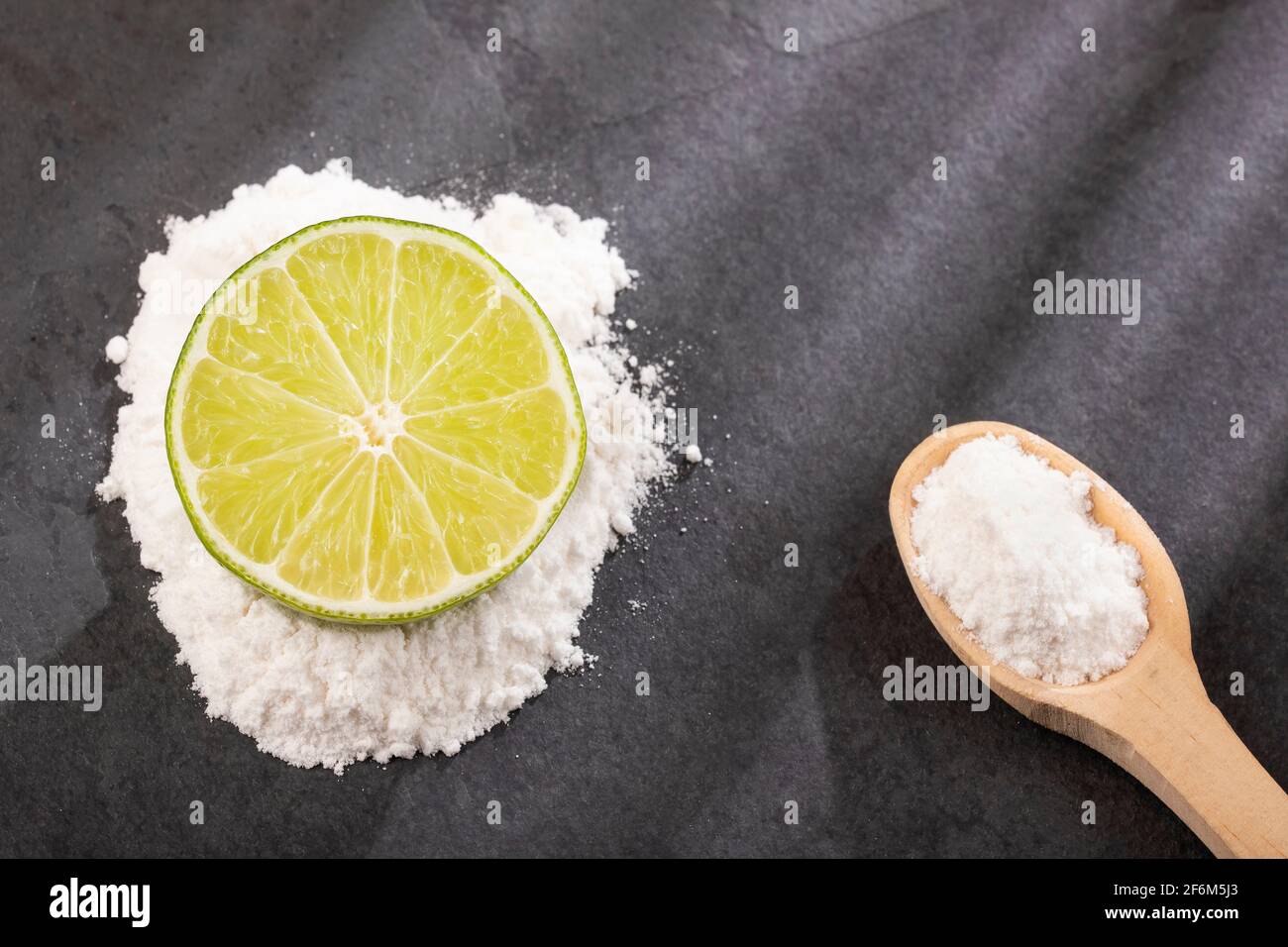 Baking soda (sodium bicarbonate) and lemon - Citrus × latifolia Stock ...